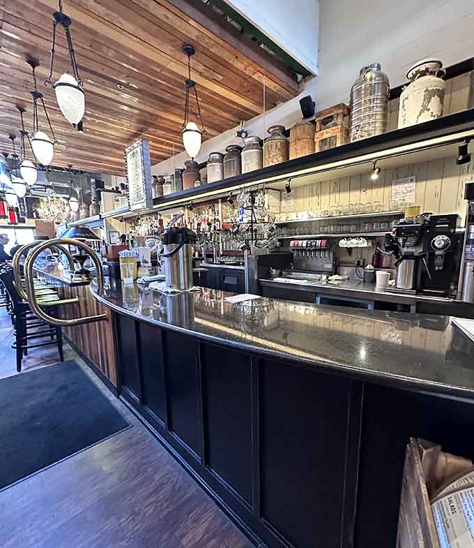 The bar gleams with promise, stocked with craft cocktails and local brews to complement every menu choice.