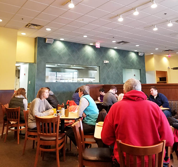 Happy diners enjoying their meals, because nothing brings people together quite like exceptional breakfast food.