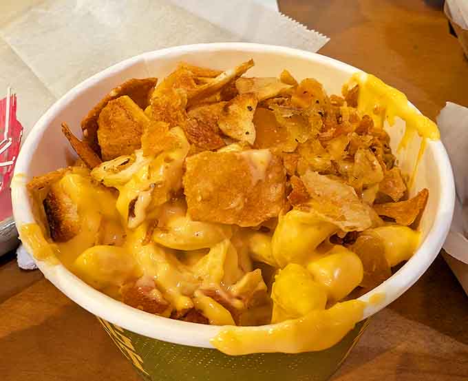 The mac and cheese deserves its own sonnet &ndash; creamy, cheesy pasta topped with crushed potato chips creates a textural contrast that makes each bite more interesting than the last.