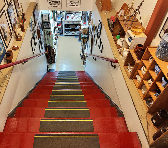 The red-painted staircase leads to even more treasures below &ndash; like Alice's rabbit hole, but with better lighting and price tags.