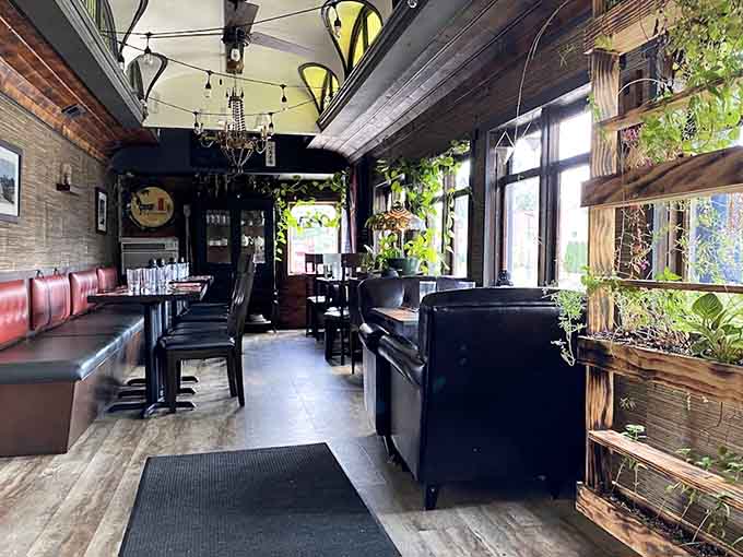 The dining car interior stretches invitingly, with red booths and warm lighting that make you want to settle in for a long, leisurely meal.