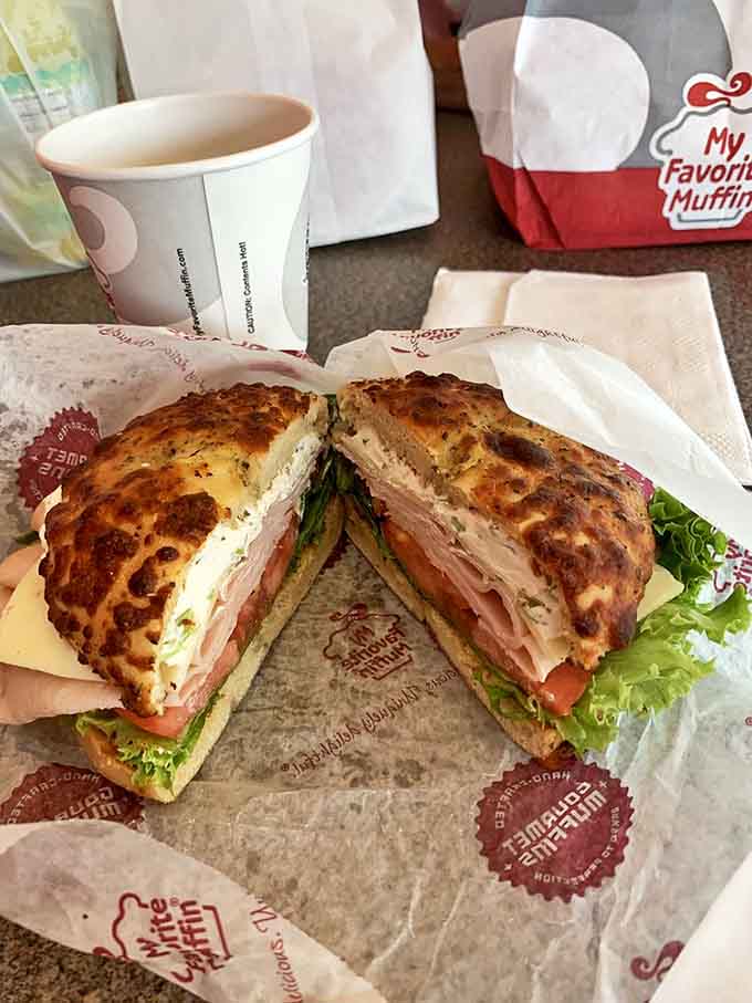 The Turkey and Havarti sandwich, sliced to reveal its perfect architecture, proves that greatness often lies in thoughtful simplicity.