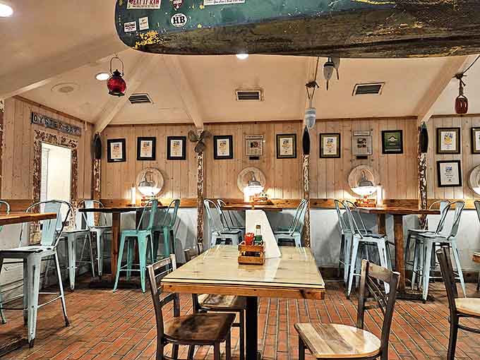 Nautical charm fills every corner of the dining area, with wood-paneled walls adorned with maritime memorabilia creating an authentic coastal vibe that feels like home.