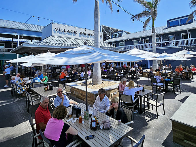 Village Brewhouse's outdoor seating area buzzes with conversation and clinking glasses &ndash; where strangers become friends over locally crafted beers.