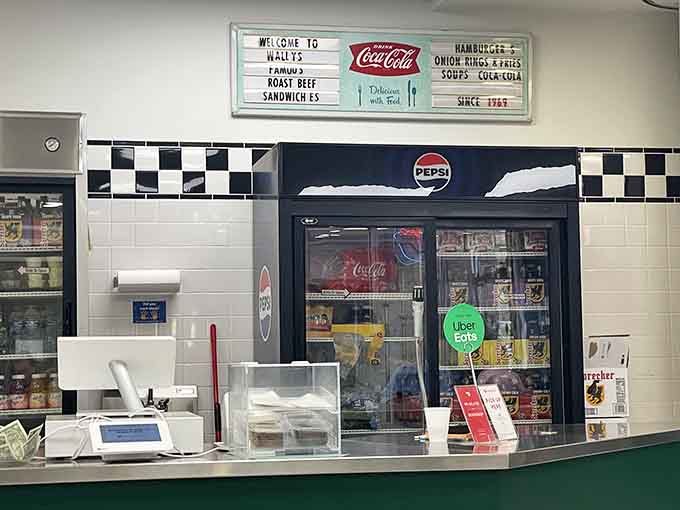 The counter where sandwich magic happens, staffed by people who've perfected the art of roast beef assembly.