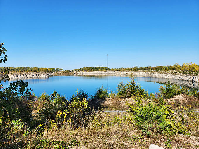 The West Quarry's azure waters reflect perfect skies, a stunning reminder of the island's industrial past transformed into natural beauty.