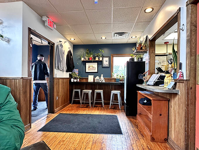 Thoughtful touches like plants and natural wood create a welcoming atmosphere that feels like dining in someone's well-loved home.