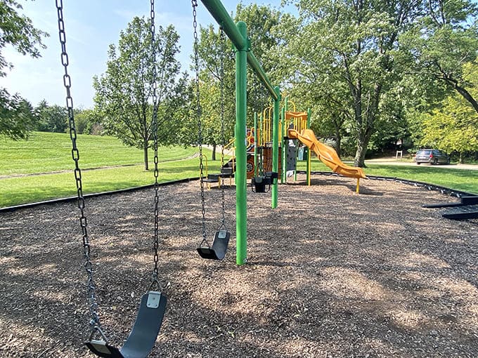 The playground equipment stands ready for action, offering slides and swings that never go out of style with the younger crowd.