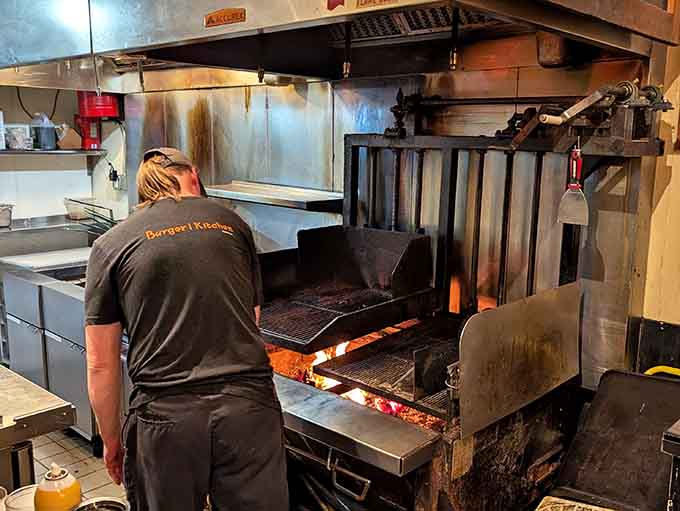 That wood-fired grill isn't just for show, it's where burger magic happens over real flames, the old-fashioned way.