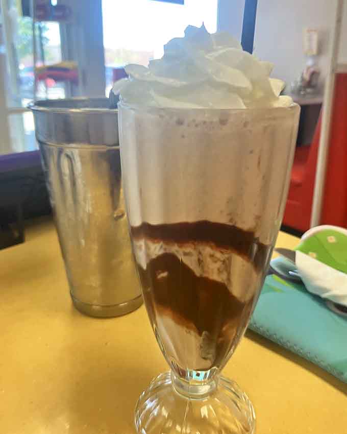 This milkshake is thick enough to require determination, creamy enough to inspire poetry, and topped with whipped cream like nature intended.