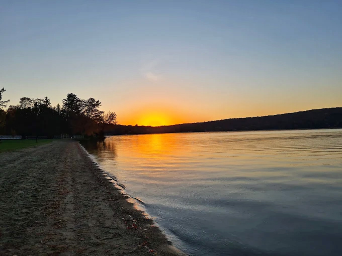 Evening brings a special magic to Branbury's shores, when the water becomes a mirror for twilight colors.
