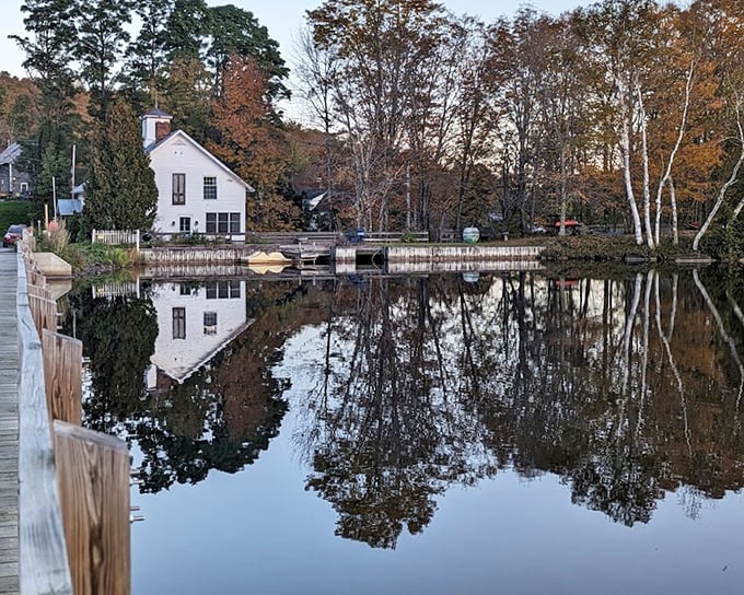 Sunset casts a golden glow across the Floating Bridge, while reflections create a perfect mirror image in the still waters below.
