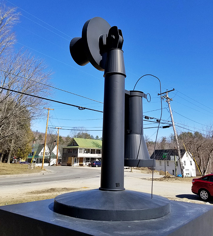The monument's distinctive profile stands out against bare winter trees, creating a stark visual reminder of communication methods past.