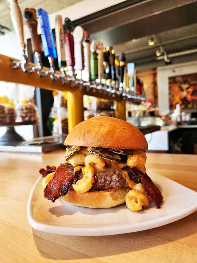 This burger isn't just wearing mac and cheese &ndash; it's proudly displaying it like a cheesy medal of honor.