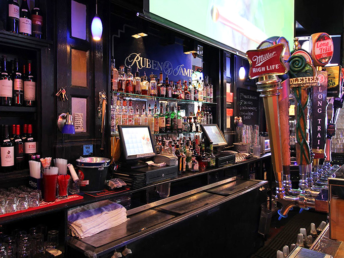 The well-stocked bar area serves as command central, where bartenders pour generous drinks and occasionally dispense life wisdom at no extra charge.