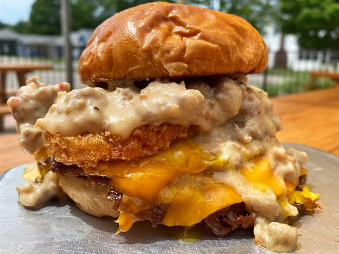 This isn't just a burger &ndash; it's an architectural marvel of melty cheese, savory sauce, and perfectly cooked beef that defies gravity.