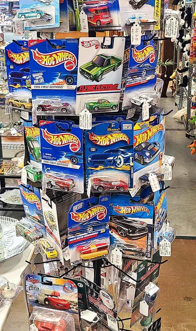 Hot Wheels and collectible toys remain frozen in their original packaging, simultaneously tempting collectors and triggering childhood memories.