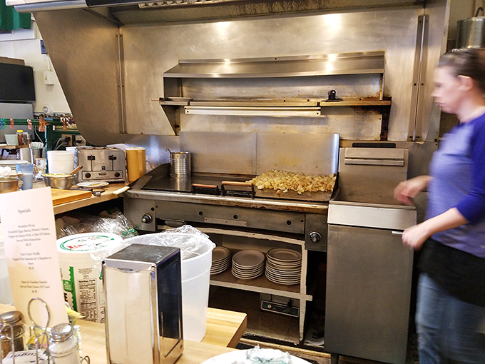 The bustling kitchen where the magic happens &ndash; watch as those famous home fries achieve golden perfection.