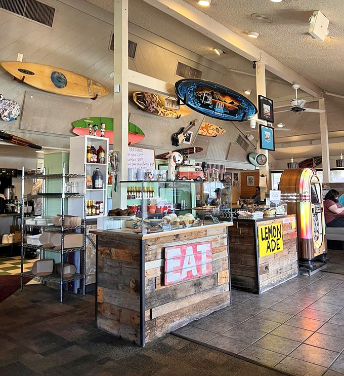 The counter area with its "EAT" sign offers simple but sound advice, while surfboards overhead create a laid-back, coastal atmosphere.