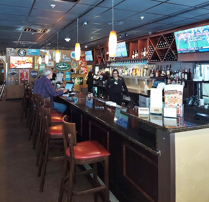 The bar area strikes that perfect balance between "I'm having a sophisticated evening" and "I might order a second round of garlic knots."