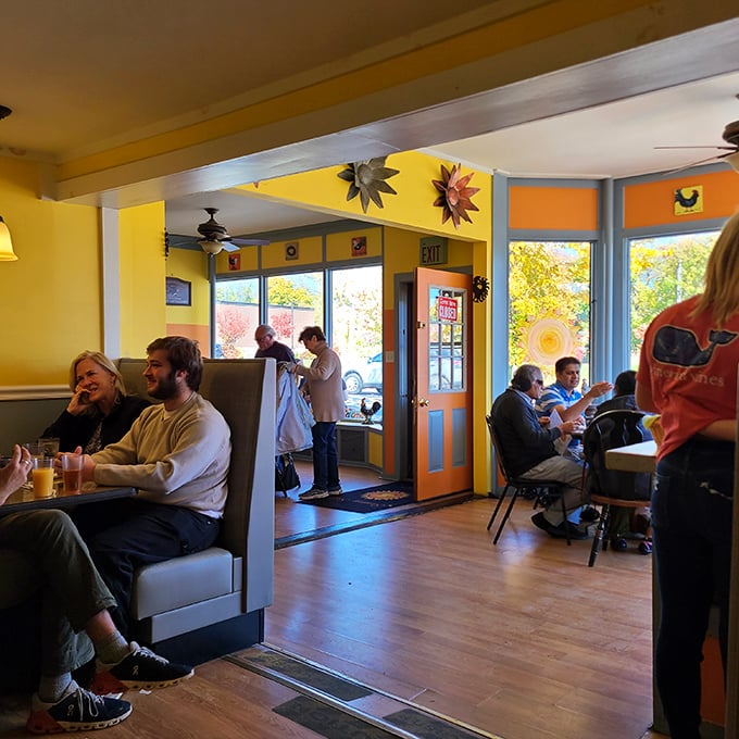 The dining room buzzes with morning energy as patrons fuel up for Vermont adventures. Happiness looks like full coffee cups.