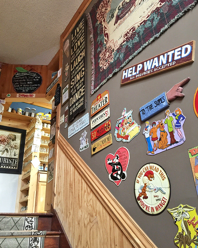 The wall of whimsy &ndash; vintage signs, cartoon characters, and playful declarations create a visual feast that entertains while you wait for your actual feast to arrive.