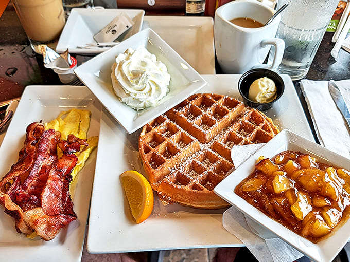 Golden waffles, crispy bacon, fluffy eggs, and a drizzle of pure comfort Brunch done right&mdash;every bite feels like a cozy morning win.