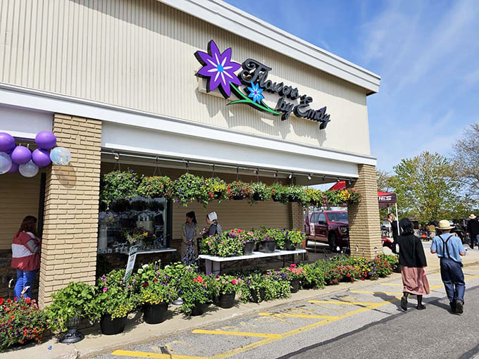 Flowers by Emily showcases beautiful blooms and gifts, while outside, you might spot traditional Amish attire alongside modern fashion &ndash; Middlefield's unique blend.