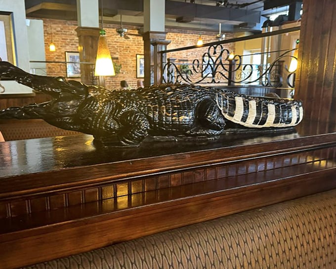 That alligator isn't judging your food choices, but he might be eyeing your leftovers &ndash; just one of Harry's quirky d&eacute;cor touches.