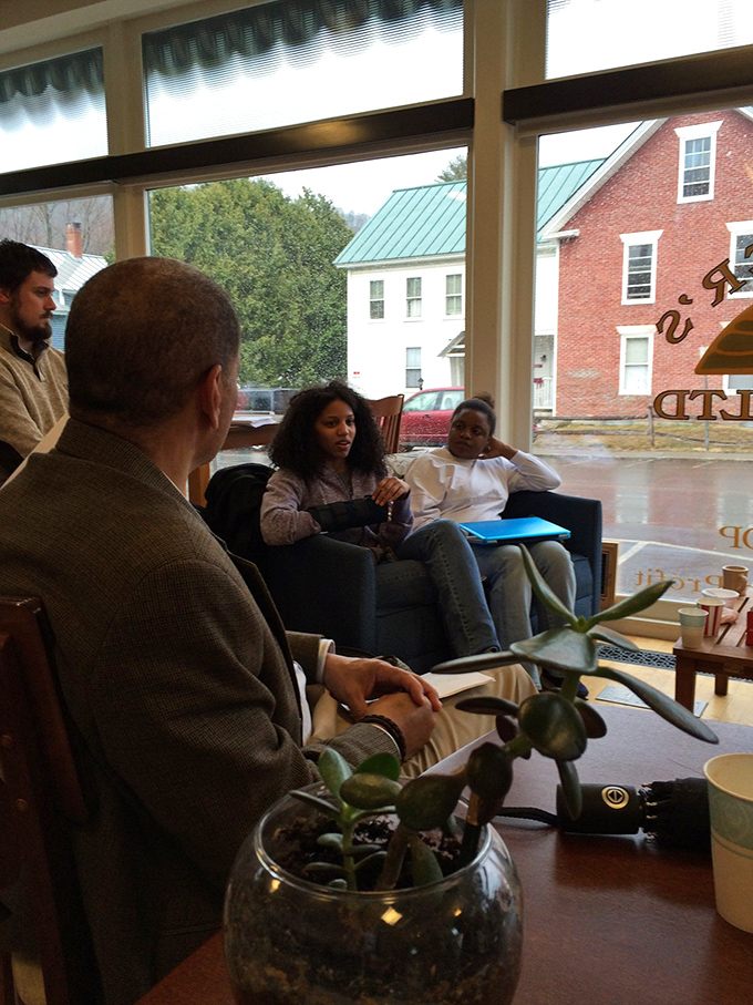 The cozy seating area hosts everything from casual conversations to formal discussions, where ideas flow as freely as the excellent coffee.