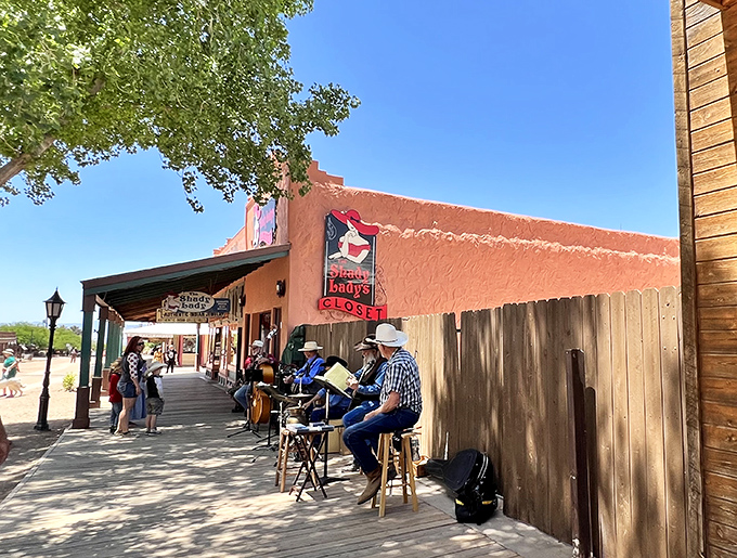 Local musicians keep Western traditions alive on Tombstone's boardwalks, their melodies floating through streets once walked by legends.