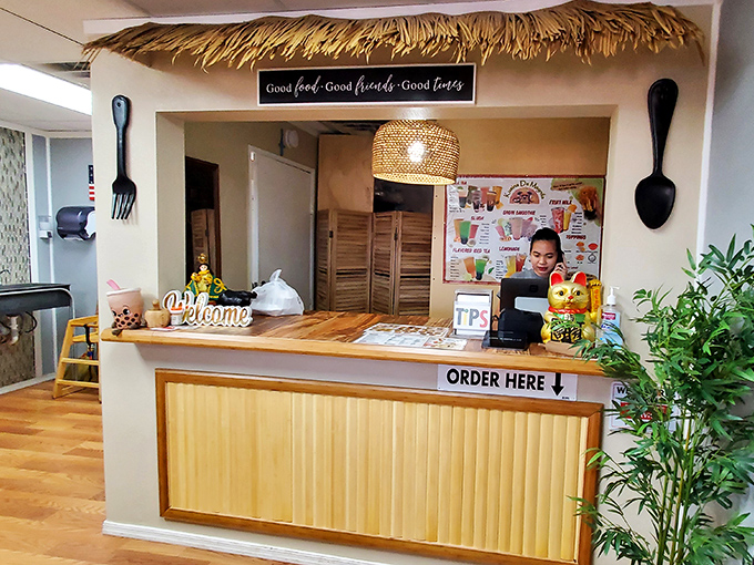 The welcoming counter where culinary adventures begin. The sign above says it all: "Good food, Good friends, Good times."