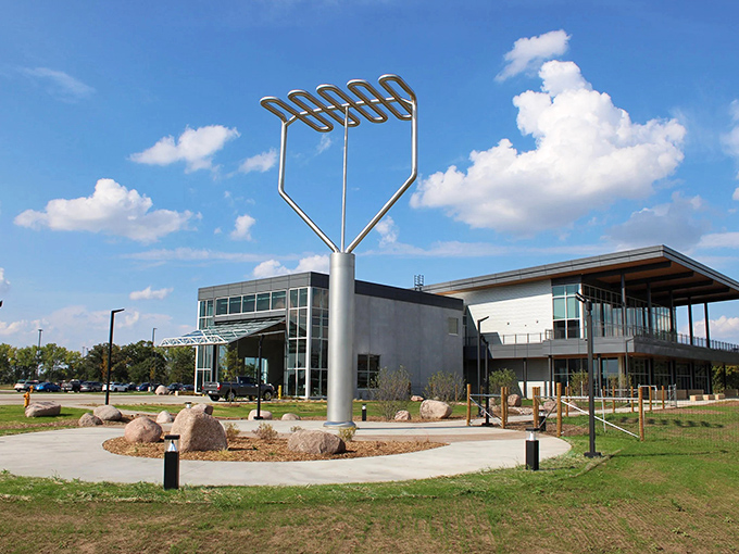 The modern Environmental Center provides an architectural backdrop that complements this quirky landmark, blending contemporary design with agricultural celebration.