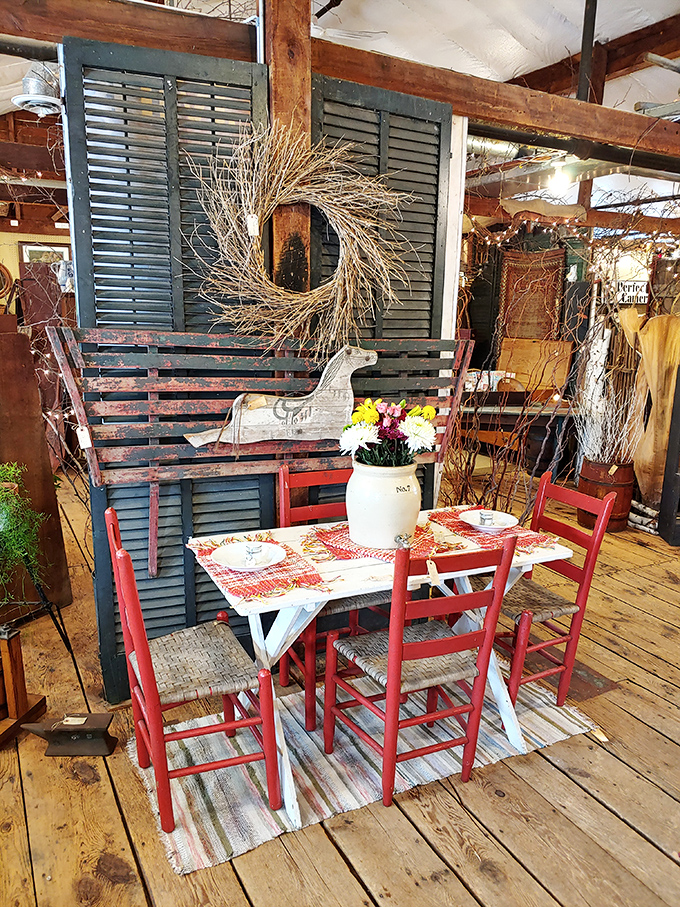 This charming dining vignette with red chairs and blue shutters isn't just furniture &ndash; it's an invitation to imagine meals from another era.