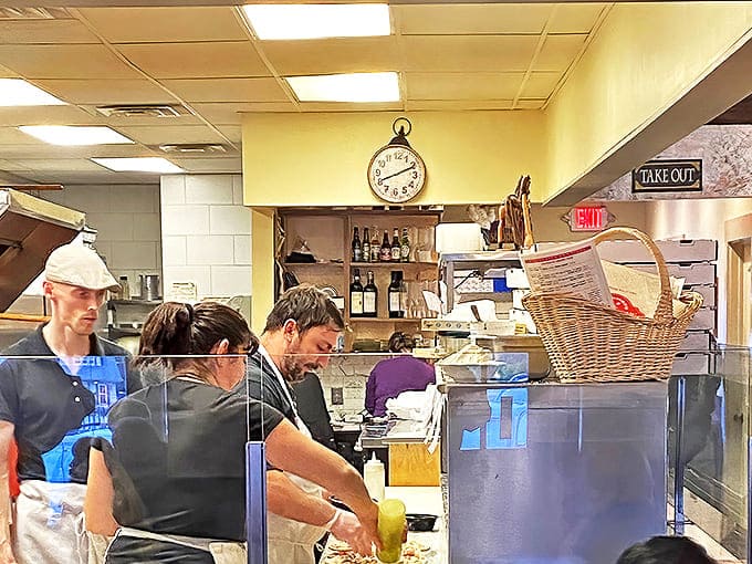 Staff: Behind the glass, Tivoli's dedicated team crafts each pizza with practiced precision. The synchronized dance of dough-tossing and topping-placing is mesmerizing kitchen theater.