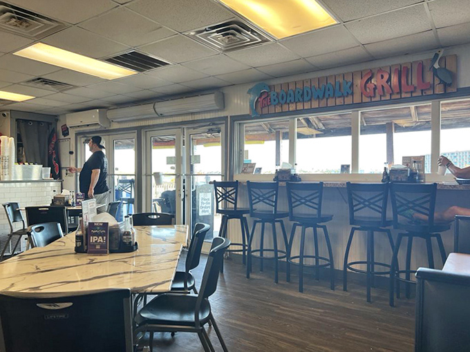 The dining area offers counter seating where regulars exchange fishing tales while waiting for their seafood fix.