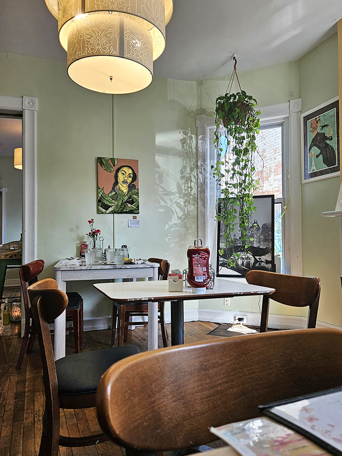 The dining room's floral wallpaper and wainscoting create a nostalgic atmosphere that feels like dinner at your favorite grandmother's house.