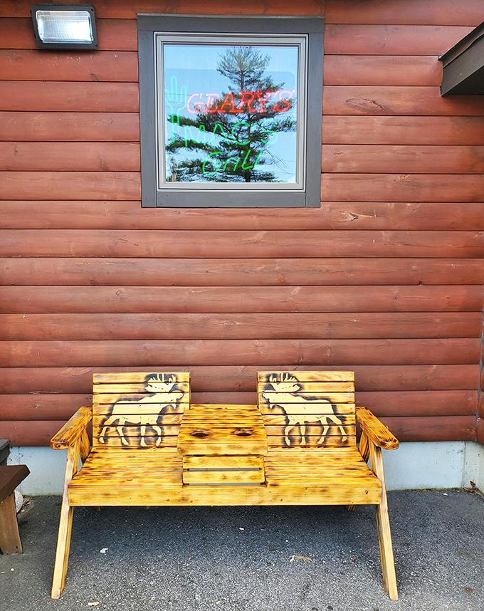 Even the outdoor seating captures Maine's rustic charm &ndash; this moose-adorned bench provides the perfect spot for pre-dinner conversation.