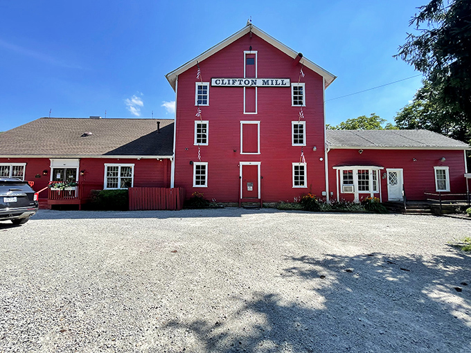 The mill's name proudly displayed on its bright red exterior serves as both landmark and invitation to curious travelers.