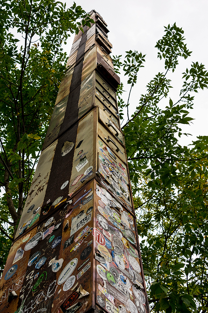 Looking up from below, the cabinet's impressive height becomes apparent, each drawer representing another year of bureaucratic waiting.