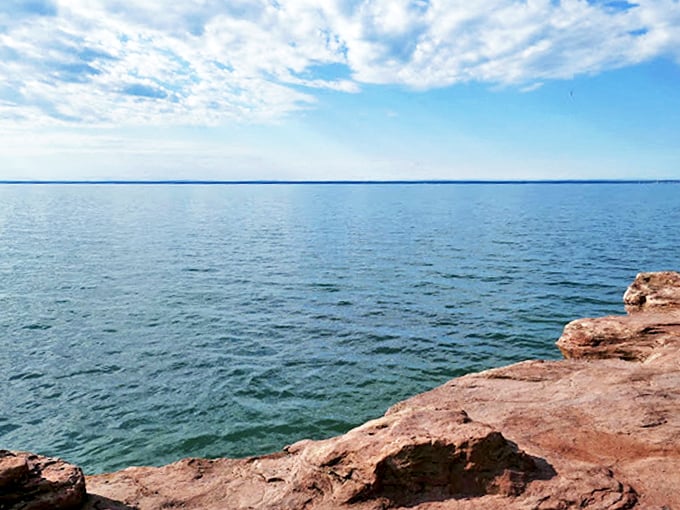 Rugged cliffs meet crystal-clear waters. It's like the Mediterranean decided to vacation in Wisconsin!