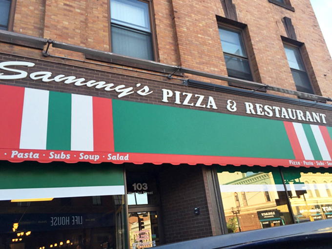 Where "I'll just have one slice" is the biggest lie in Duluth. The green, white, and red awning promises Italian-American heaven, and it delivers.
