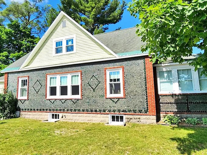 This side view of the Kaleva Bottle House reveals the intricate diamond patterns created by embedding medicine bottles in the walls, a true folk art masterpiece.