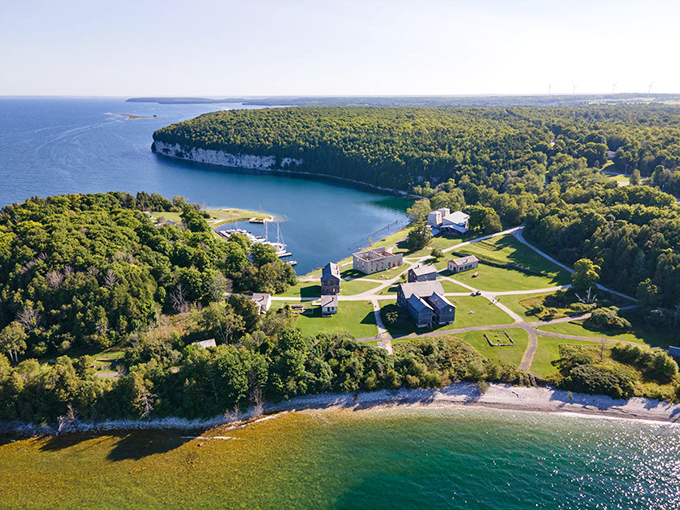 This breathtaking aerial view showcases Fayette's perfect position between limestone cliffs and protected harbor, explaining why industrialists chose this spot.
