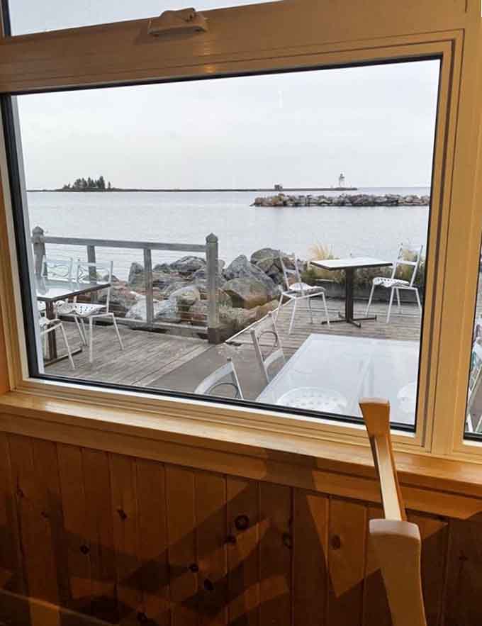 Window seats offer front-row views of Lake Superior's ever-changing moods, making every meal feel like dinner theater where nature provides the entertainment for free.