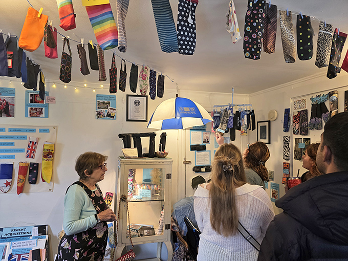 Guests gather for an umbrella cover tour, discovering that sometimes the most memorable attractions come in the smallest packages.