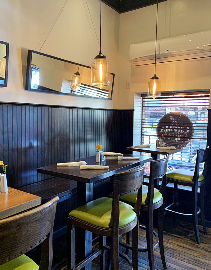 Pendant lights cast a warm glow over intimate tables where breakfast dreams come true one bite at a time.