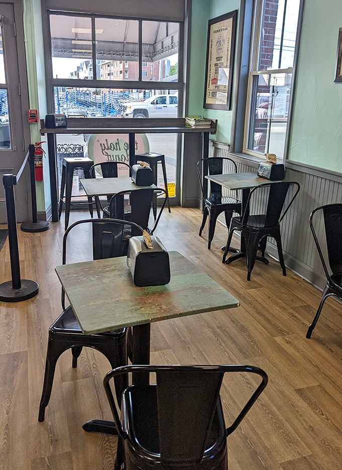 Simple metal chairs and distressed wooden tables create a no-fuss environment where the donuts rightfully remain the star of the show.