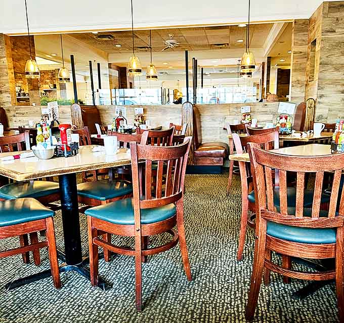 Another Interior Angle: Wooden booths and thoughtful lighting create intimate breakfast nooks where morning conversations flow as freely as the coffee.