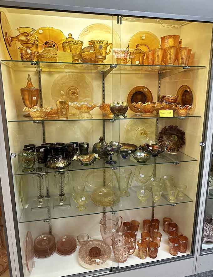 Glassware in amber and carnival colors catches the light like edible sunshine, making you wonder why modern dishes are so boring when they could literally glow like this.